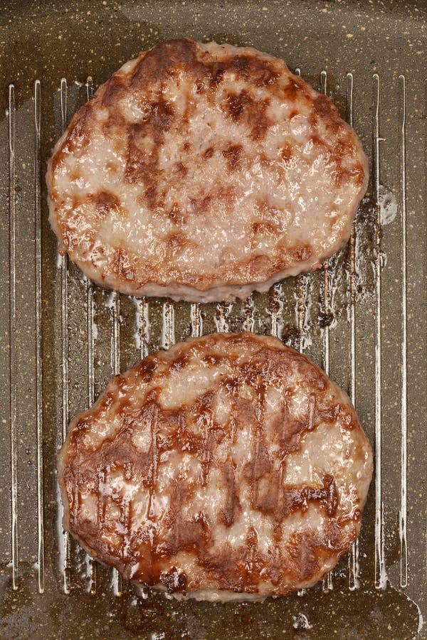 Two round burger patties stock image. Image of meal - 376113823