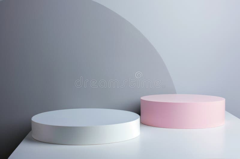 Two Round, Cylindrical Platforms, One White and One Pink, Sit on a ...