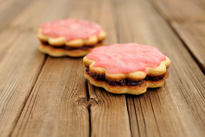 Two Round Sand Cakes Decorated with Pink Icing and Jam on Rustic Stock ...