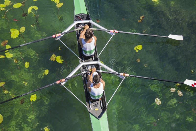 Two rowers rowing editorial photography. Image of canoe - 72693757