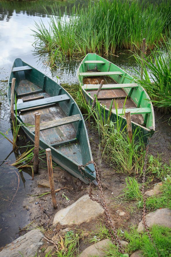 Two Rowing Boats on Muddy River Shore Stock Photo - Image of beautiful ...
