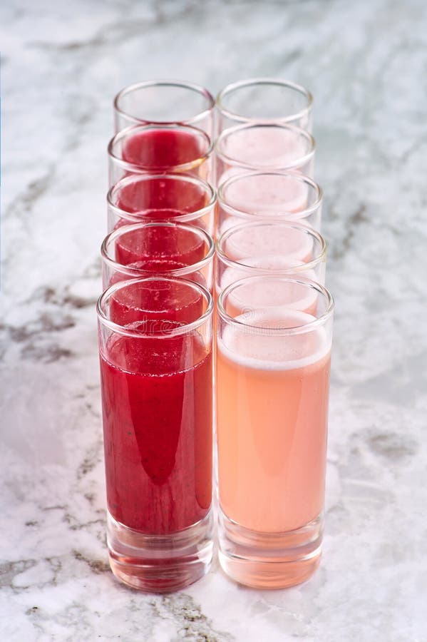 Set of Shot Cocktails with Lemon, Vanilla Liqour, Vodka and Lilac Layer ...