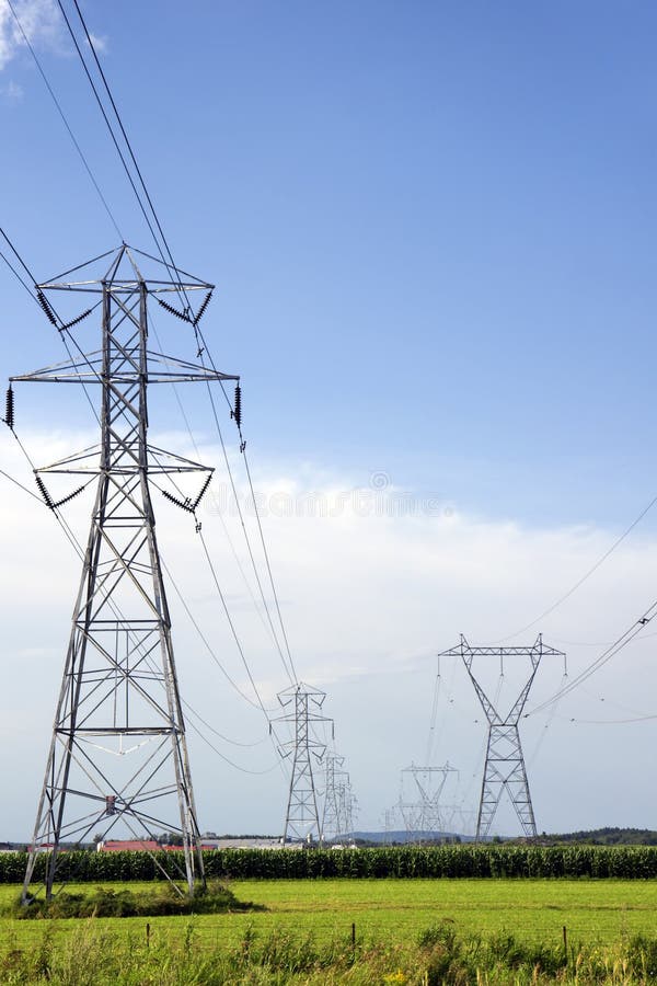 Two Rows of Electric Pylons Stock Photo - Image of material, renewable ...