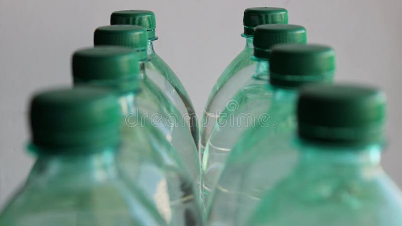 Two Rows of Plastic Water Bottles with Focus on the Last Bottles ...