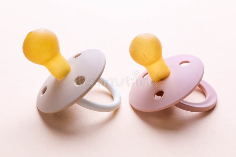 Two rubber pacifiers stock photo. Image of childhood - 278083198