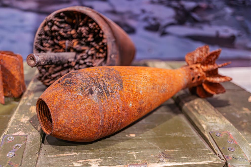 Two Rusted Cylindrical Objects on a Metal Surface, Possibly an Old ...