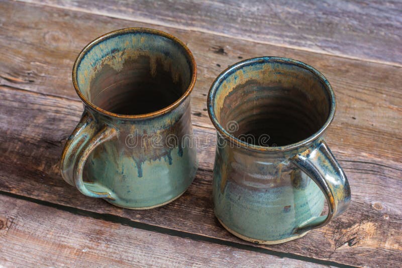 Two Rustic Clay Mugs on a Old Barn Board Floor Stock Image - Image of ...