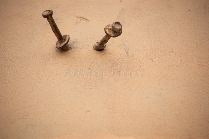 Two Rusty Bolt Screwed into a Stone Wall Stock Image - Image of ...