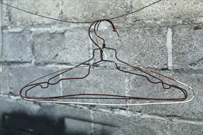 Two Rusty Iron Clothes Hangers Stock Image - Image of crack, coat ...