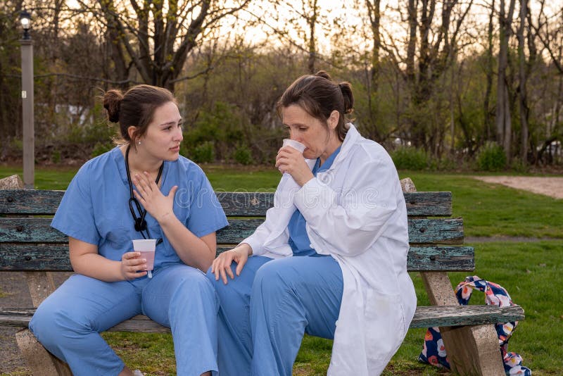Two Sad Nurses Taking a Break Outside Stock Image - Image of sadness ...