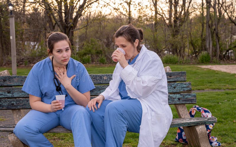 Two Sad Nurses Taking a Break Outside Stock Image - Image of sadness ...