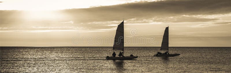 2 sailboats in sunset sea stock photo. Image of tallships - 245188246