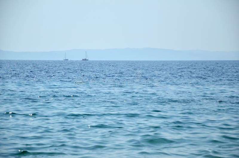 Two Sailing Boats in Distance Stock Image - Image of outdoor, blue ...