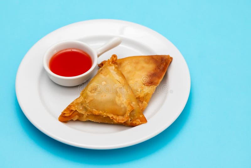 Two Samosas with Meat and Vegetables on White Plate Stock Image - Image ...