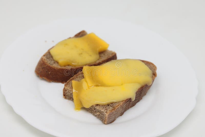 Two Sandwiches with Cheese and Rye Bread for Breakfast, Warmed Up in ...