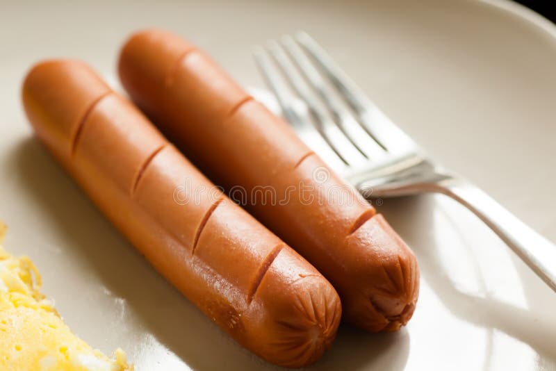 Two Sausages on the White Plate. Selective Focus, Close-up Stock Photo ...