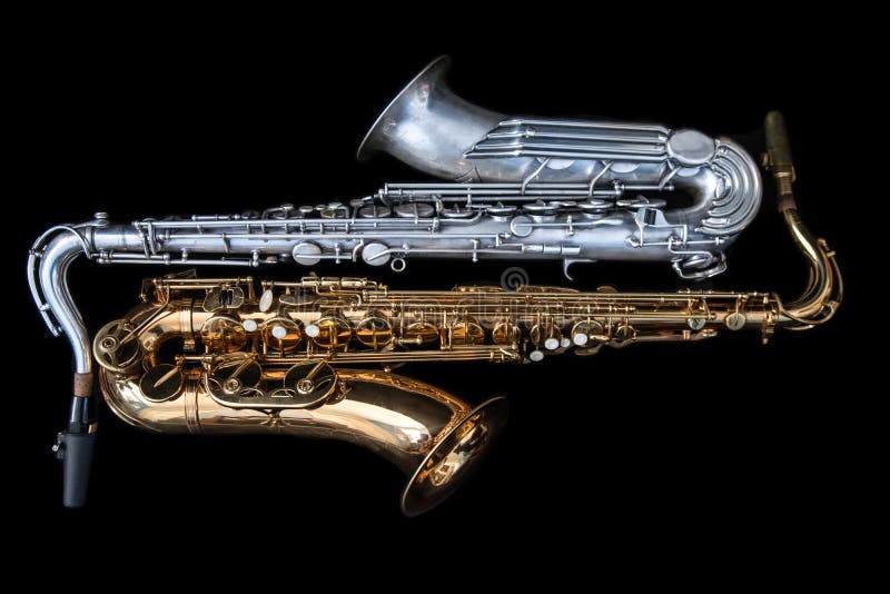 Two saxophones lying down stock photo. Image of complete - 108504156