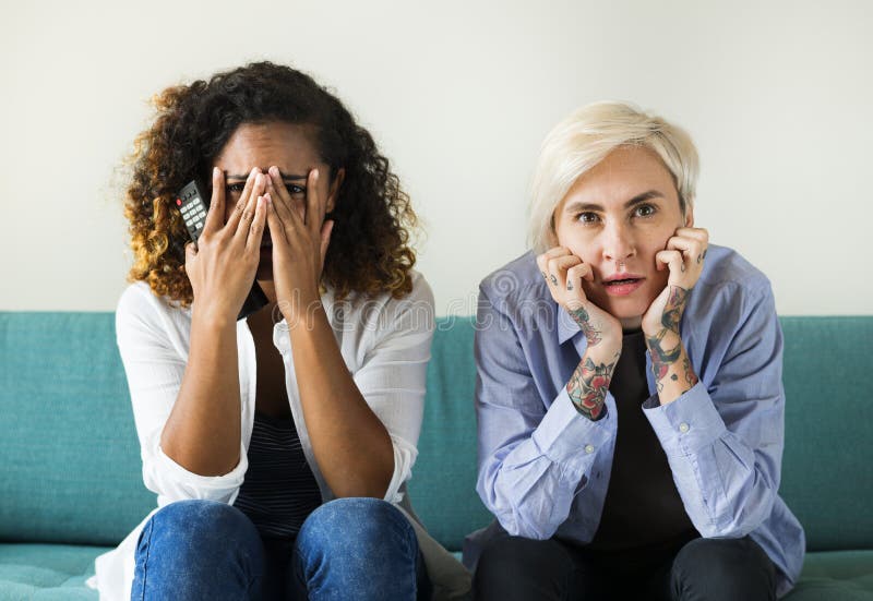 Two Scared Girls on the Couch Stock Photo - Image of frightened, focus ...
