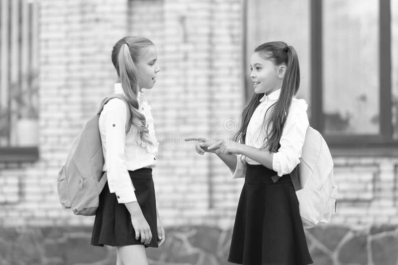 Two School Girls Friends Talking Together Duting School Break Stock ...
