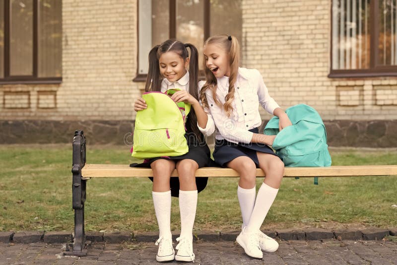 Two School Girls Sit on Bench with Backpack Together. Knowledge Day ...