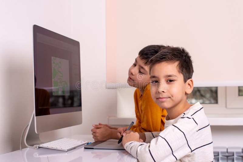 Two Schoolboys Drawing on a Computer Using a Tablet Stock Image - Image ...