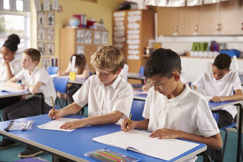 Two Schoolboys Working in a Primary School Class Stock Image - Image of ...