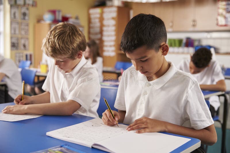 Two Schoolboys Working in a Primary School Class, Close Up Stock Photo ...