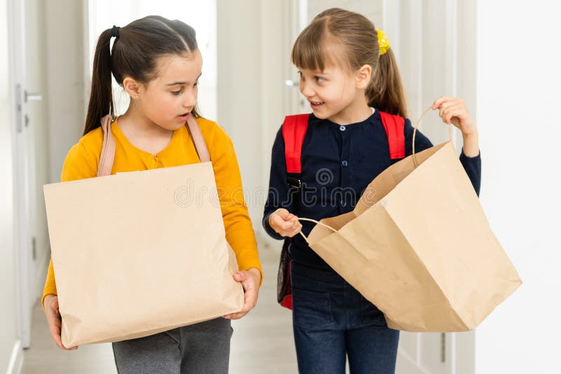 Two Schoolgirls with Delivery Packages Stock Photo - Image of postal ...