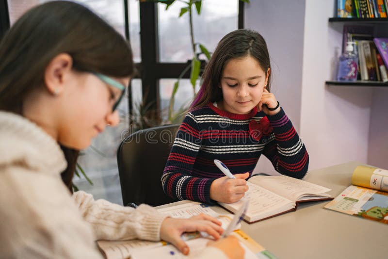 Two Schoolgirls Learning Together at Language School Class Stock Image ...
