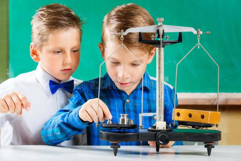 Two Schoolmates Use Scales on Lesson in School Stock Photo - Image of ...