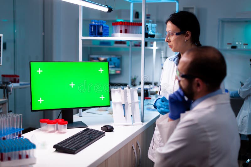 Two Scientis Using Computer with Green Screen in Laboratory Stock Image ...