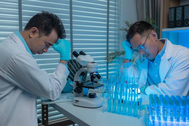 Two Scientist Feel Stressed and Tired because they Have Been Working in ...