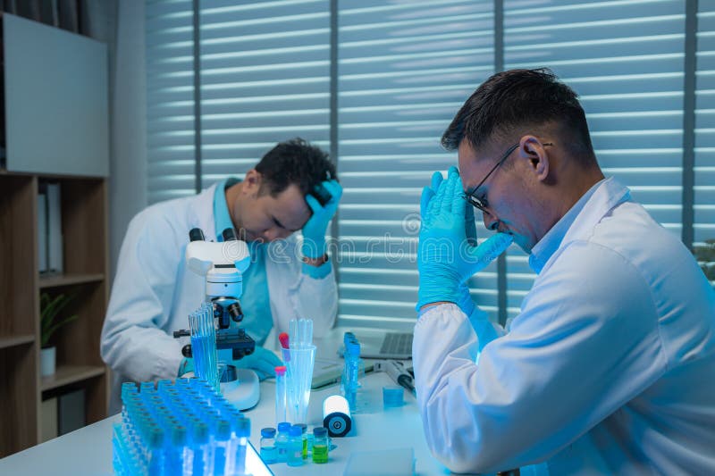 Two Scientist Feel Stressed and Tired because they Have Been Working in ...