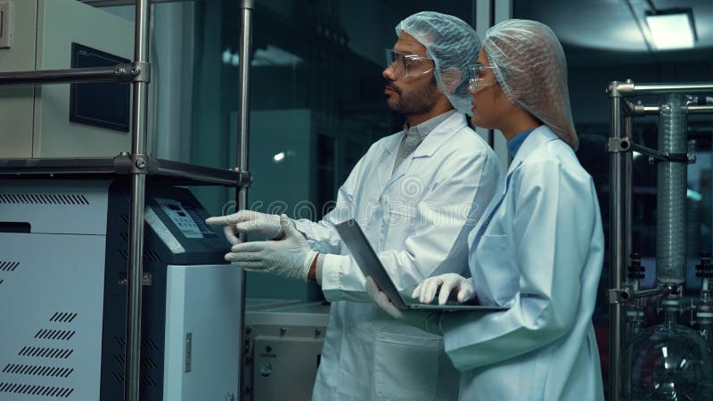 Two Scientist in Professional Uniform Working in Laboratory Stock Image ...