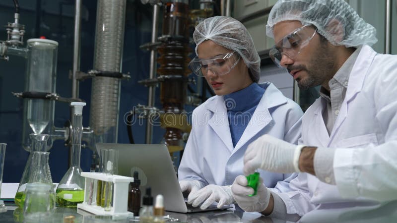 Two Scientist in Professional Uniform Working in Laboratory Stock Photo ...