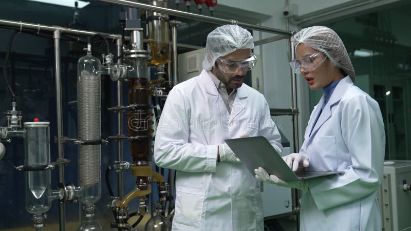 Two Scientist in Professional Uniform Working in Laboratory Stock Photo ...