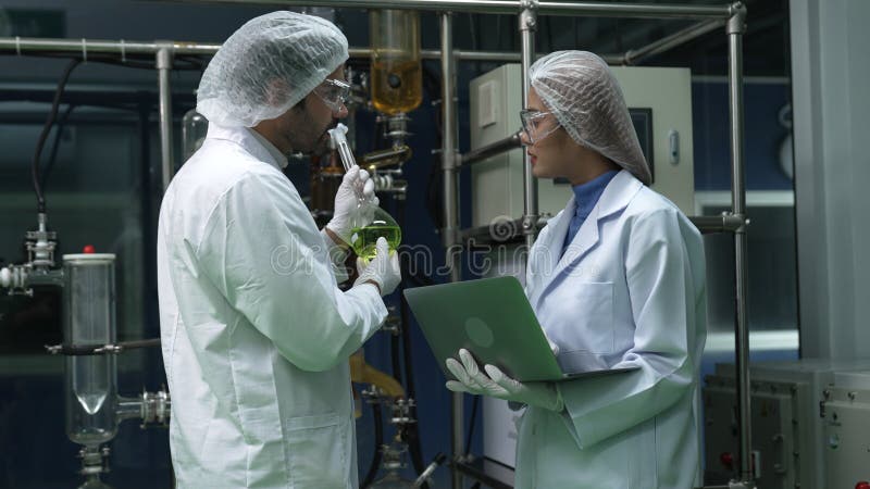 Two Scientist in Professional Uniform Working in Laboratory Stock Photo ...