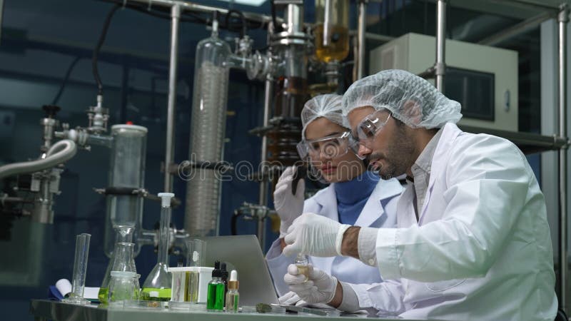 Two Scientist in Professional Uniform Working in Laboratory Stock Photo ...