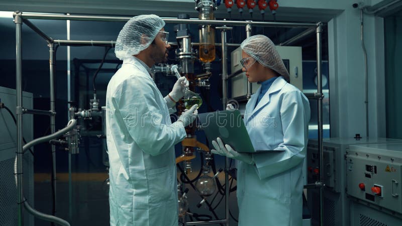 Two Scientist in Professional Uniform Working in Laboratory Stock Image ...