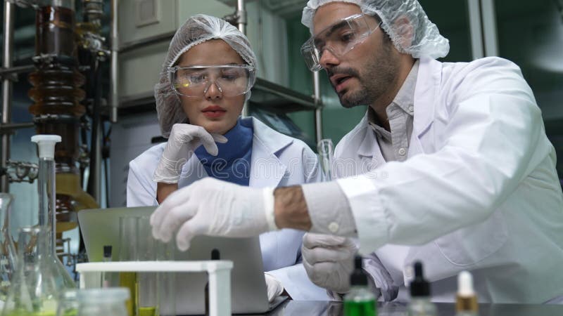 Two Scientist in Professional Uniform Working in Laboratory Stock Image ...