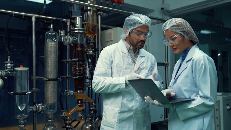 Two Scientist in Professional Uniform Working in Laboratory Stock Image ...