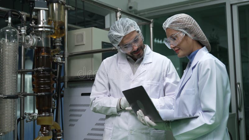 Two Scientist in Professional Uniform Working in Laboratory Stock Image ...
