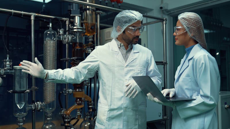 Two Scientist in Professional Uniform Working in Laboratory Stock Photo ...