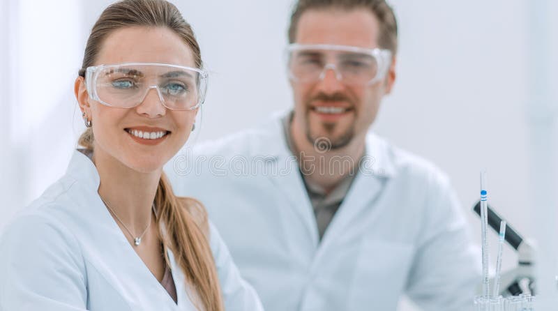 Two Scientists Biologists Sitting in a Laboratory. Stock Photo - Image ...