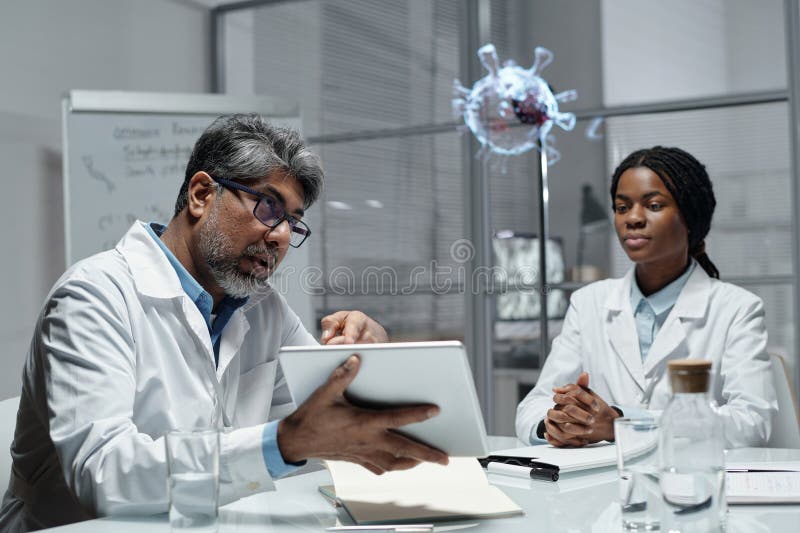 Collaborating Scientists Discussing Research Findings Stock Image ...