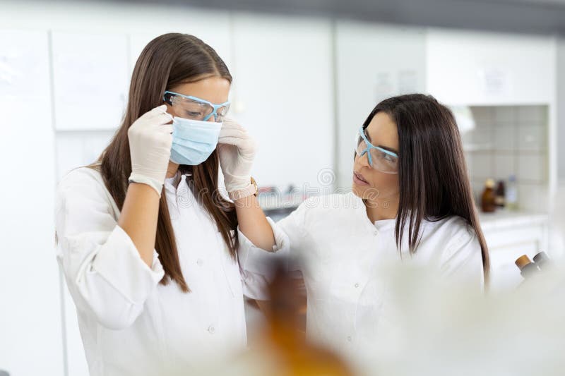 Two Scientists in Lab Coats Working Together in a Lab Stock Image ...