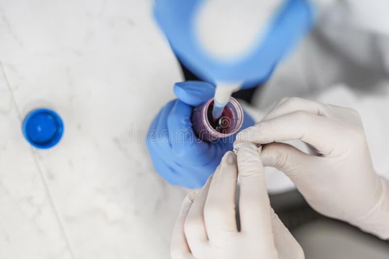 Two Scientists in the Laboratory Filling Test Tubes with Pipette Stock ...