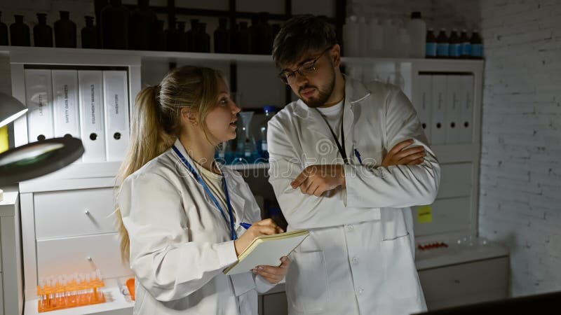 Two Scientists, a Man and a Woman, Collaborating and Discussing ... Two Scientists, a Man and a Woman, Collaborating and Discussing ...