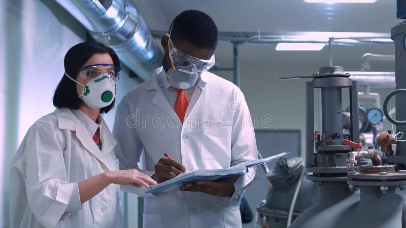 Two Scientists with the Notepad Stock Image - Image of equipment ...