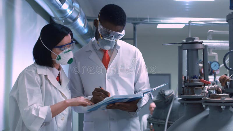 Two Scientists with the Notepad Stock Photo - Image of plant, female ...